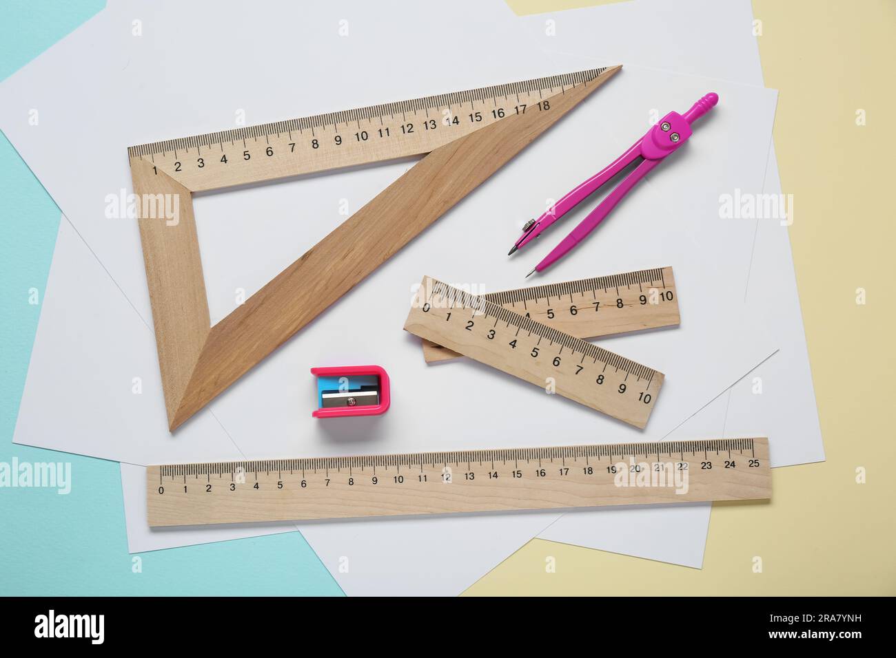 Different rulers and compass on color background, flat lay Stock Photo ...