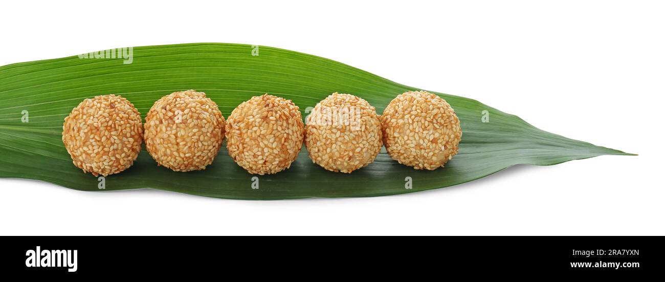 Delicious sesame balls and green banana leaf on white background Stock ...