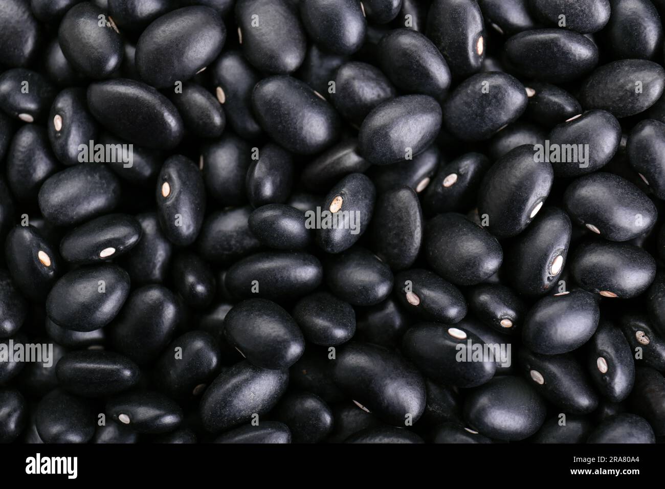 Many raw black beans as background, closeup Stock Photo - Alamy
