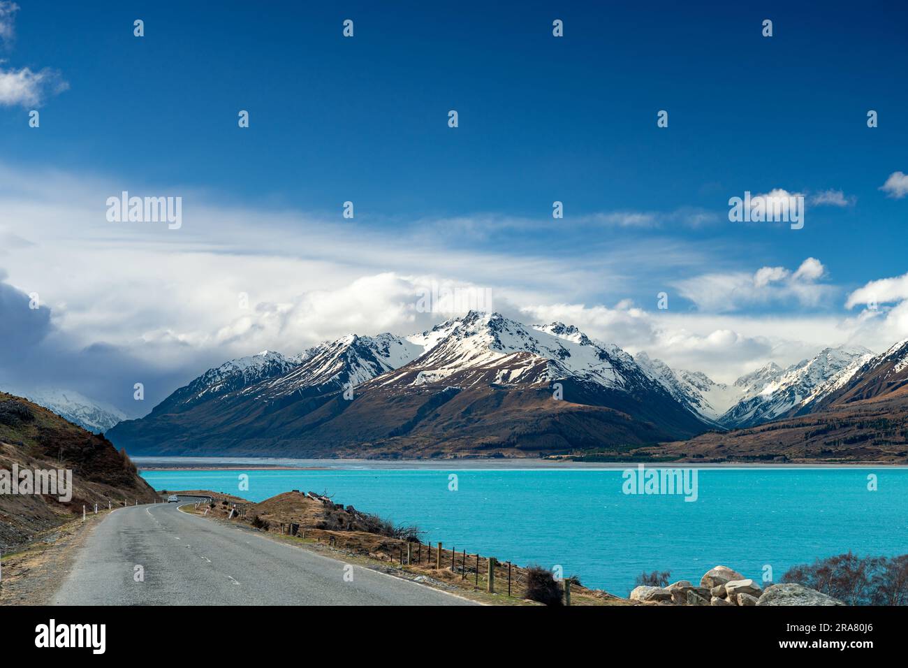 Scenic view at Mount Cook Road alongside Lake Pukaki with snow capped ...