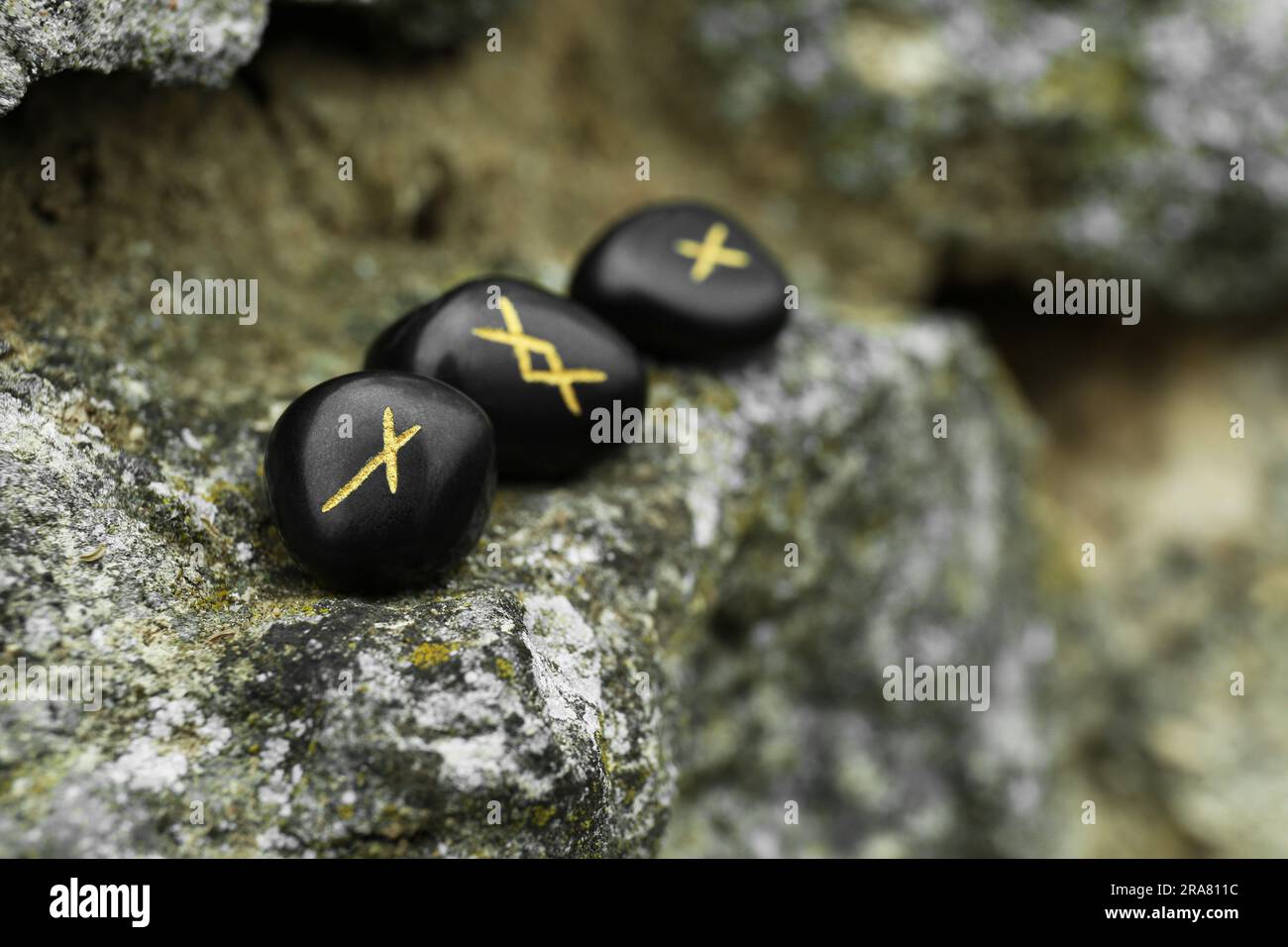 Black runes on stone outdoors, closeup. Space for text Stock Photo - Alamy