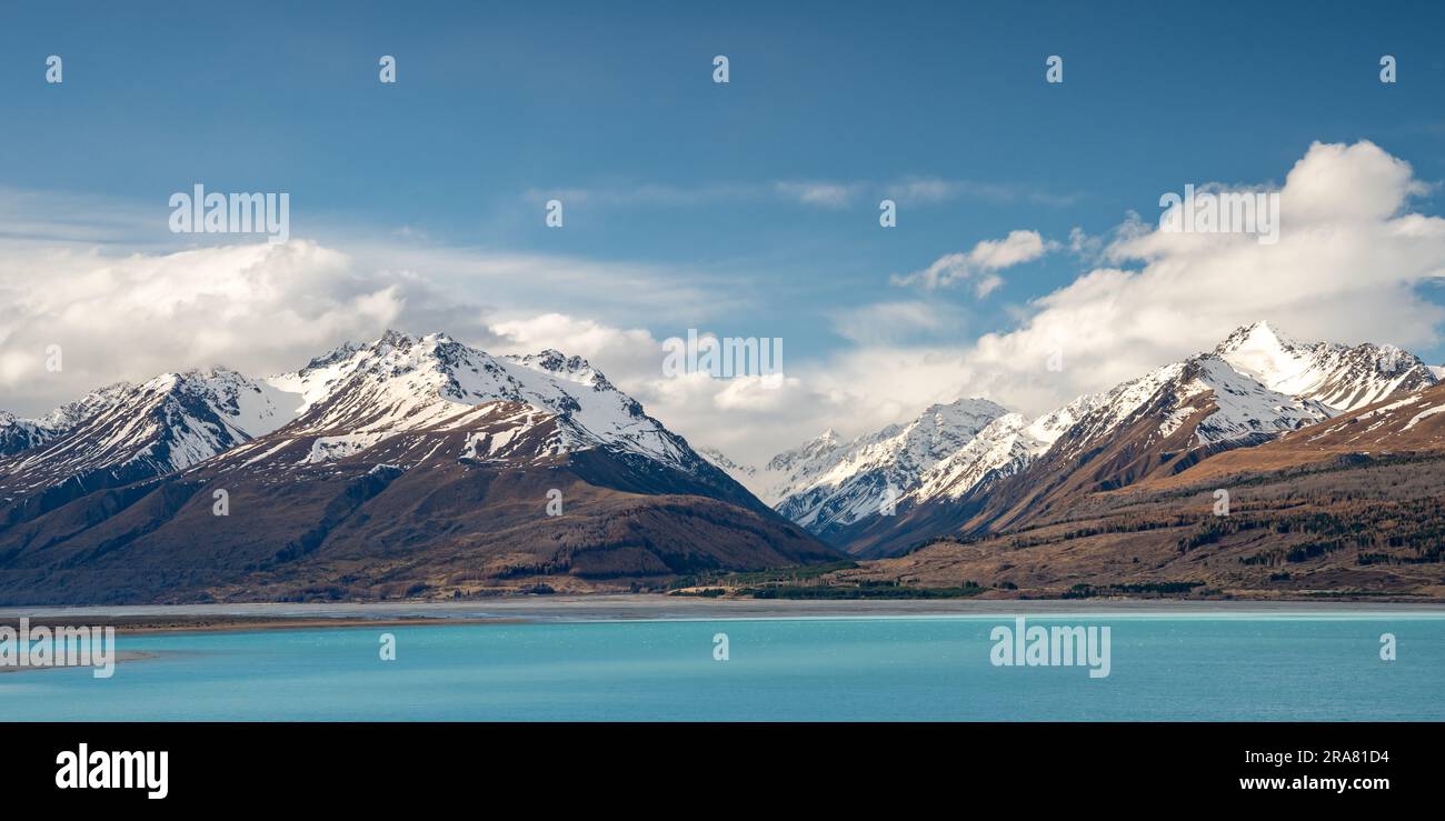Scenic view at Mount Cook Road alongside Lake Pukaki with snow capped ...