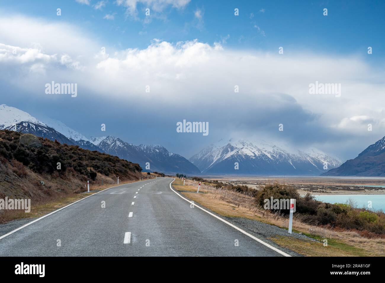 Scenic view at Mount Cook Road alongside Lake Pukaki with snow capped ...
