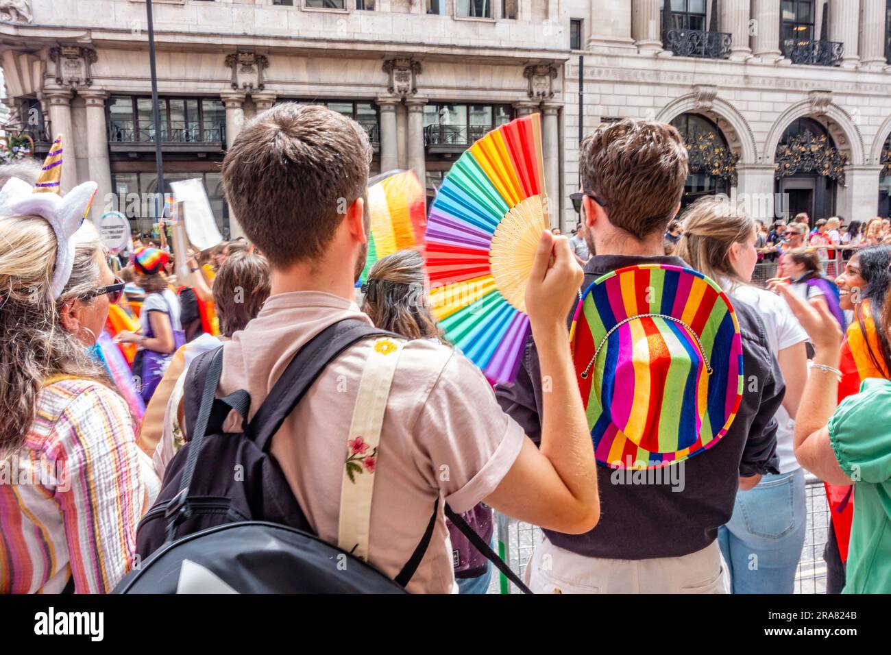 People in the crowd watching the 2023 London Pride parade pass along ...