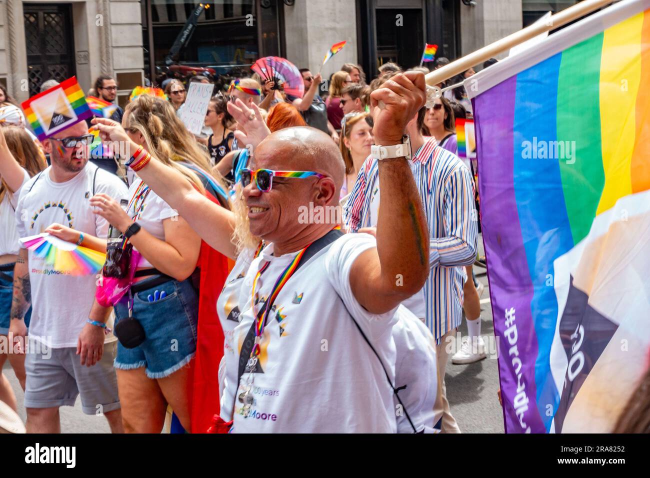 Carrying large rainbow flag hi-res stock photography and images - Alamy