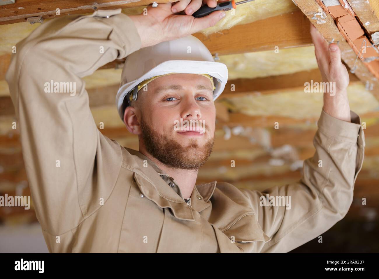 man as builder carrying wood and working Stock Photo - Alamy