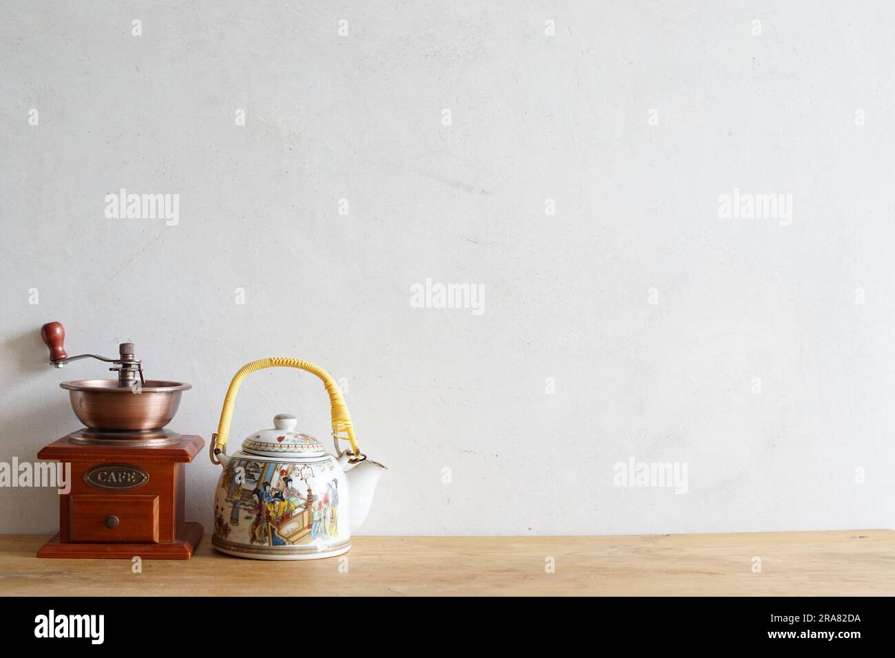 Vintage manual coffee grinder and ceramic traditional chinese tea pot ...