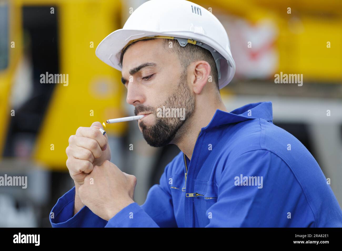 Construction worker smokes cigarette hi-res stock photography and ...