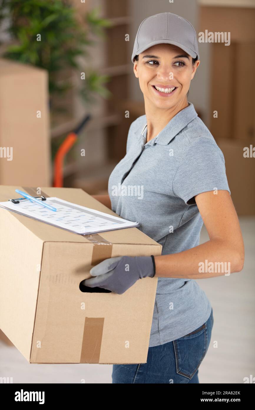 happy joyful young female courier Stock Photo - Alamy