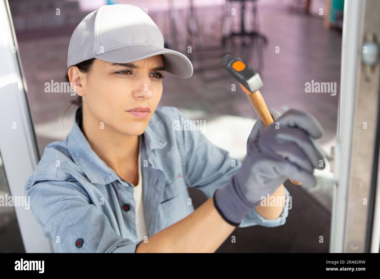 female worker checks the level of a window Stock Photo - Alamy
