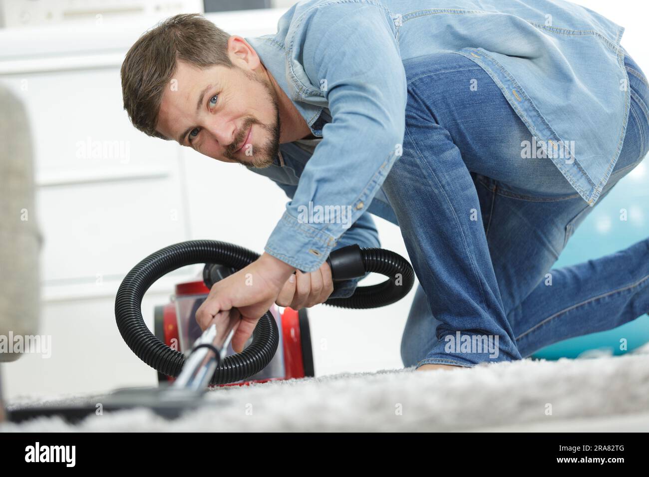 Man hoovering room hi-res stock photography and images - Alamy
