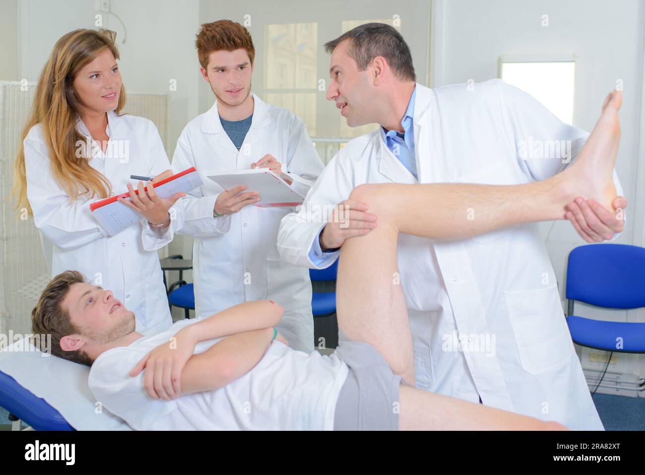 Doctor taking notes on checkup hi-res stock photography and images - Alamy