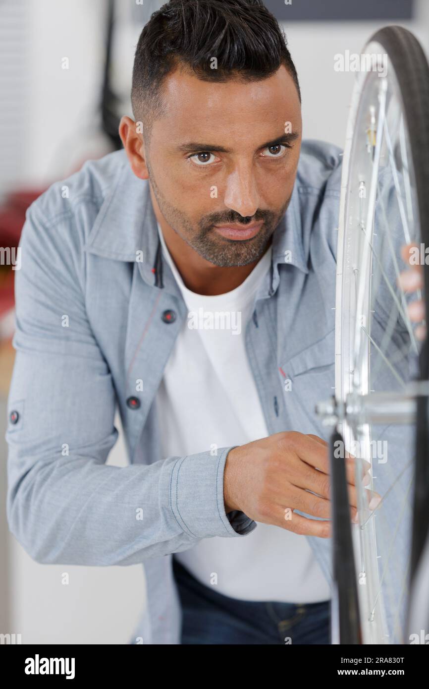Repairing a cycle hi-res stock photography and images - Alamy
