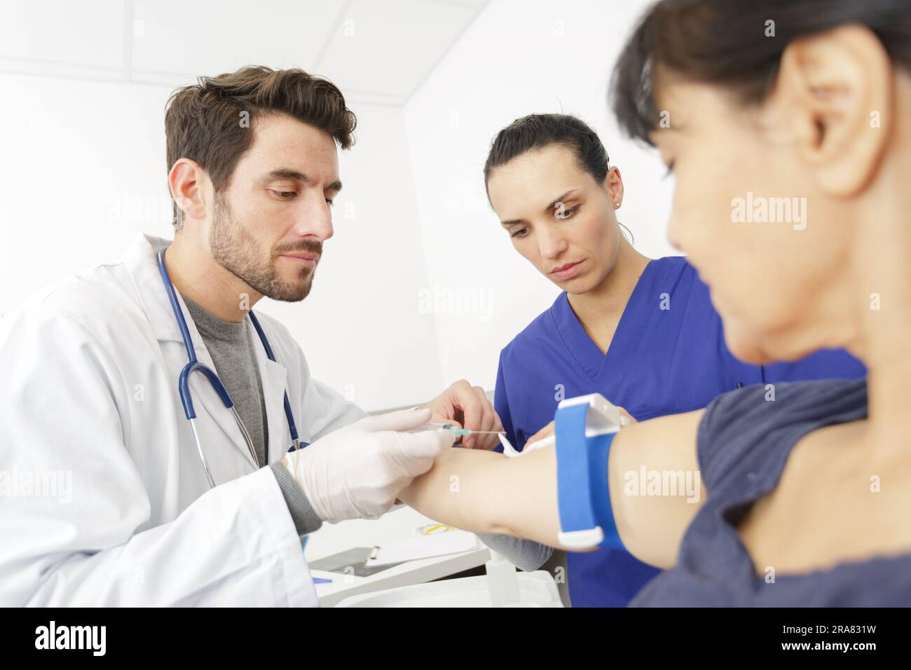 Syringe tourniquet needle arm hi-res stock photography and images - Alamy