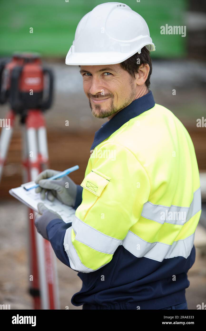 land surveyor at work on a construction site Stock Photo - Alamy