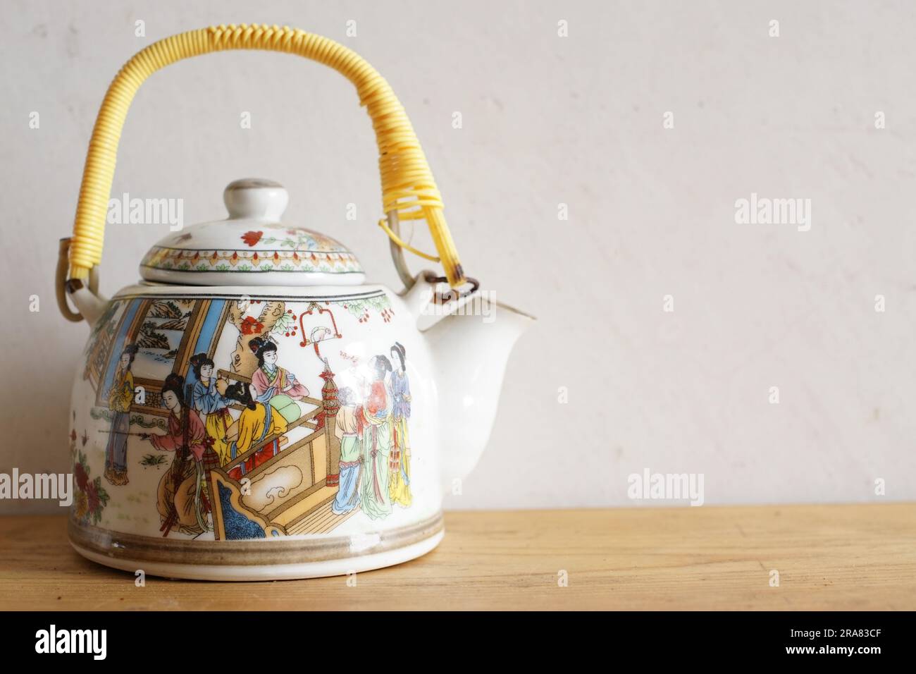 Vintage chinese ceramic tea pot on white and wooden background Stock ...