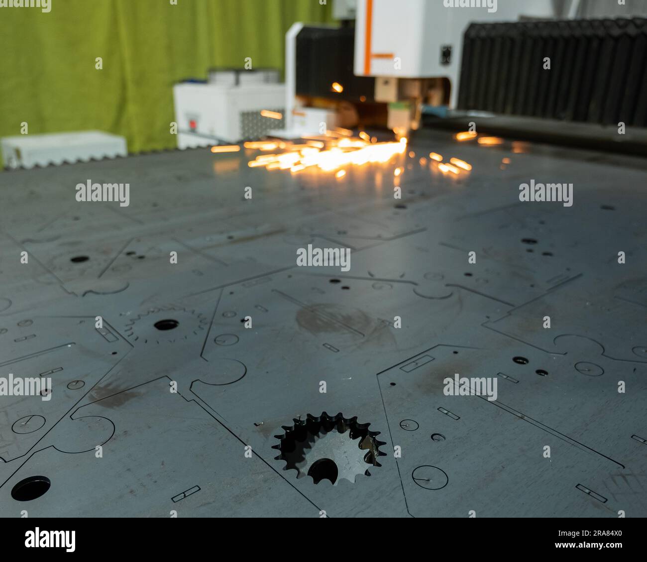 CNC machine. Laser cutting of metal. Sparks Stock Photo - Alamy