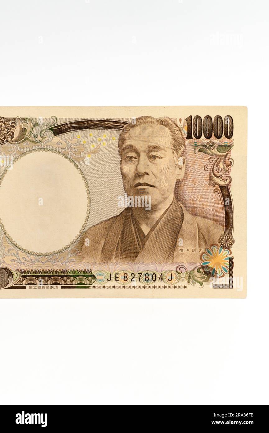 Front view of 10000 yen note in close-up isolated on white background ...