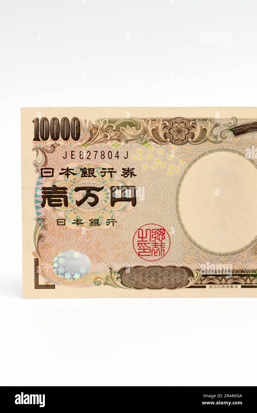 Front view of 10000 yen note in close-up isolated on white background ...
