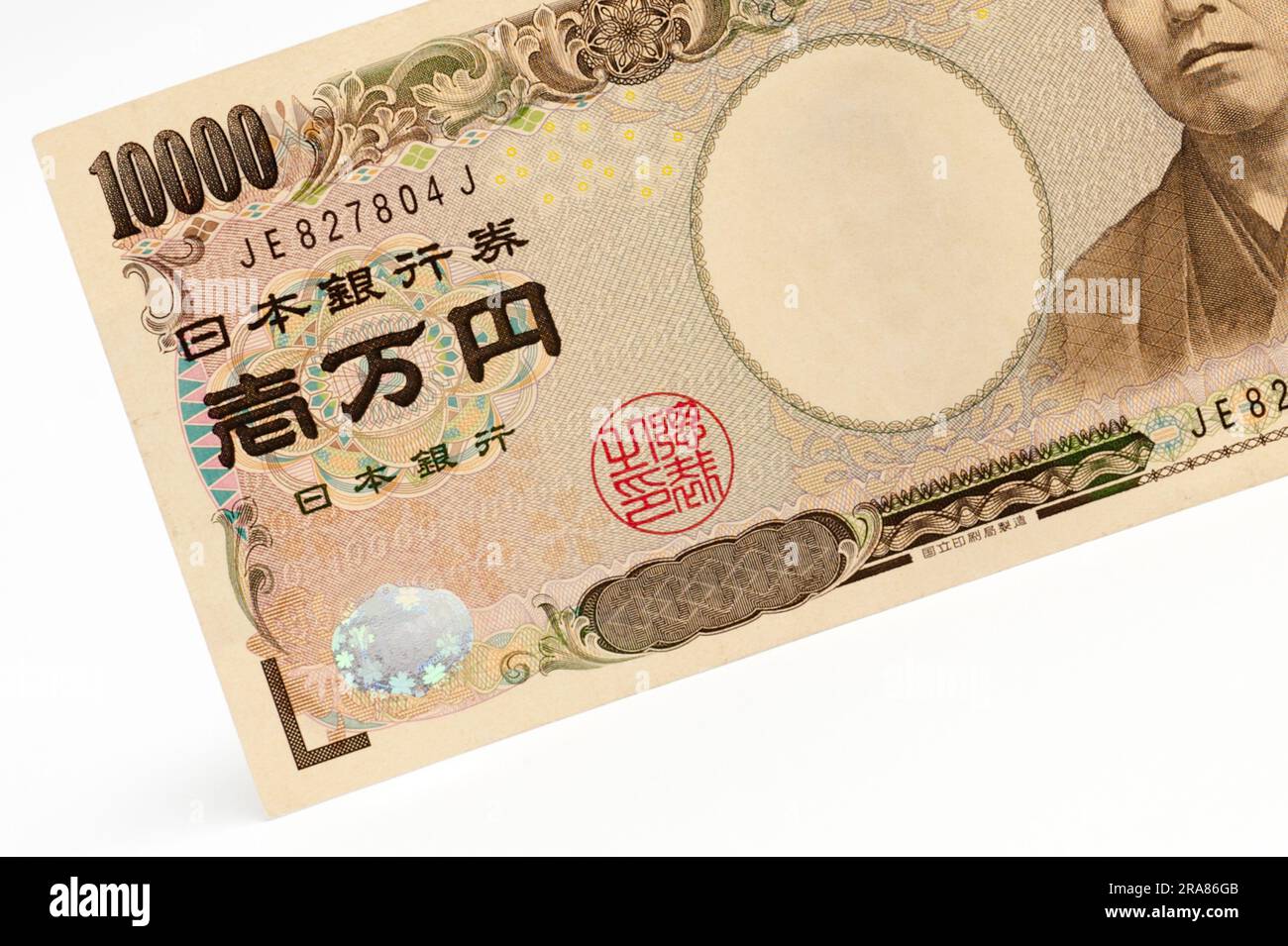 Front view of 10000 yen note in close-up isolated on white background ...