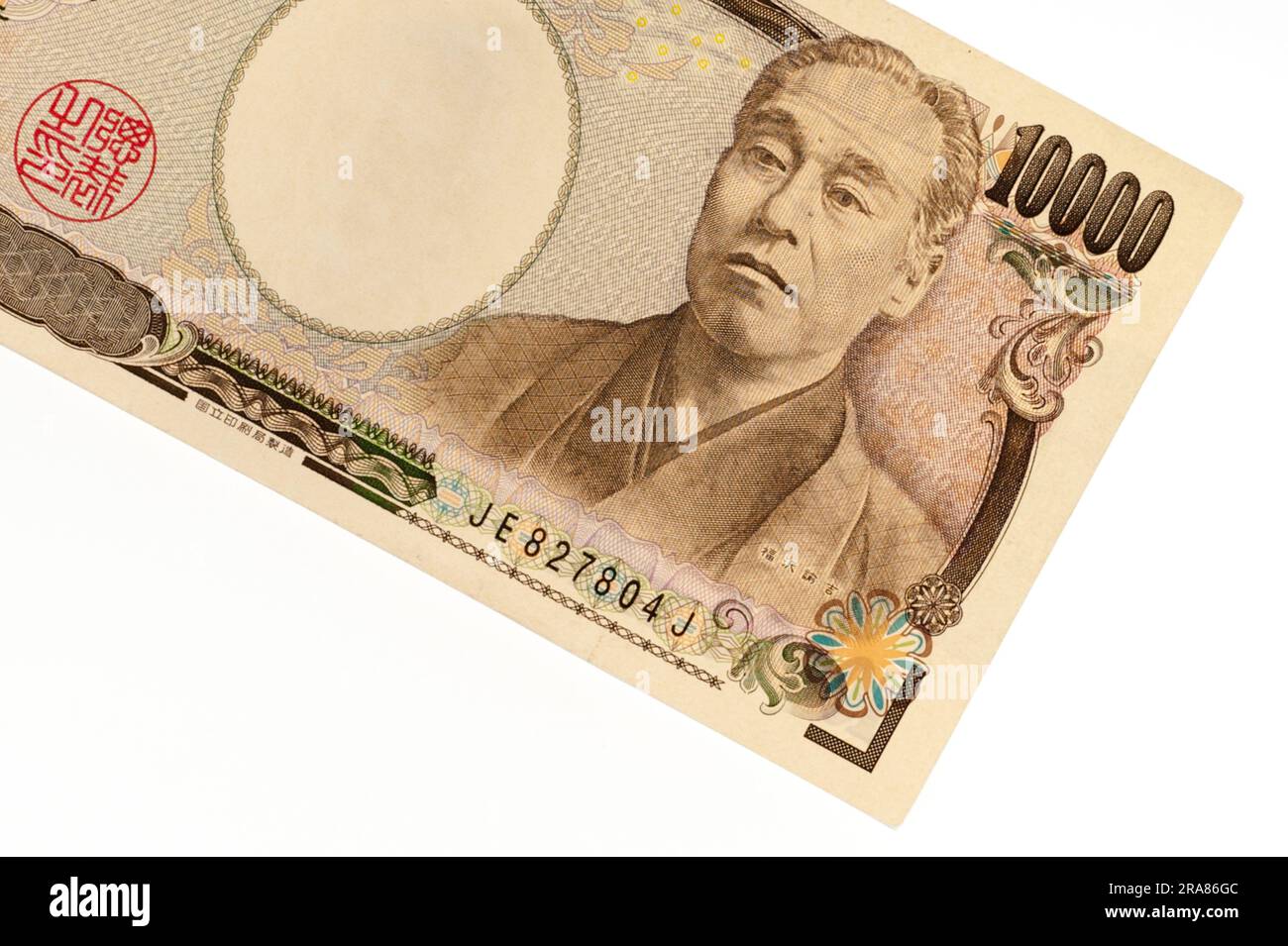 Front view of 10000 yen note in close-up isolated on white background ...