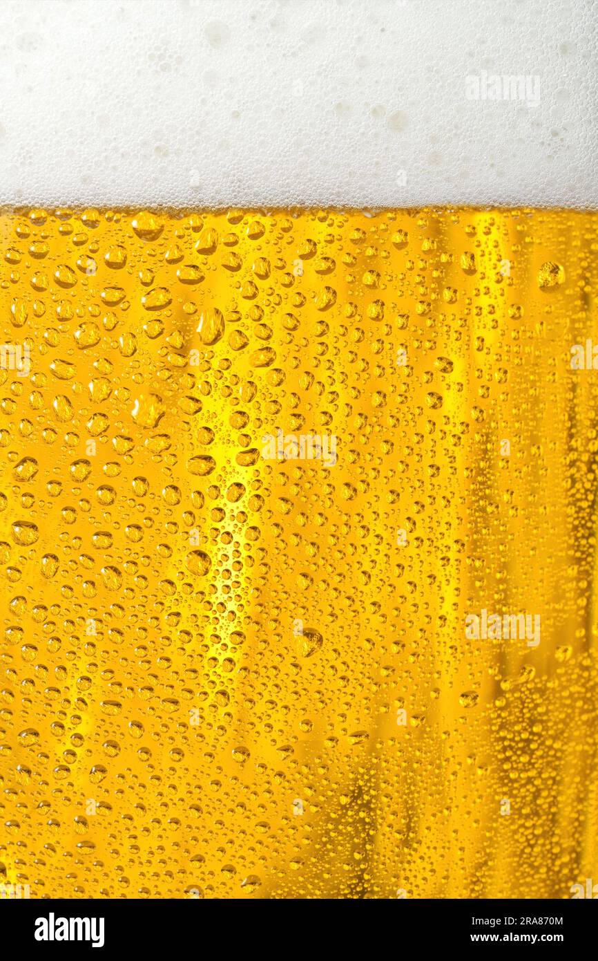 Beer. Light beer with bubbles and foam background Stock Photo - Alamy