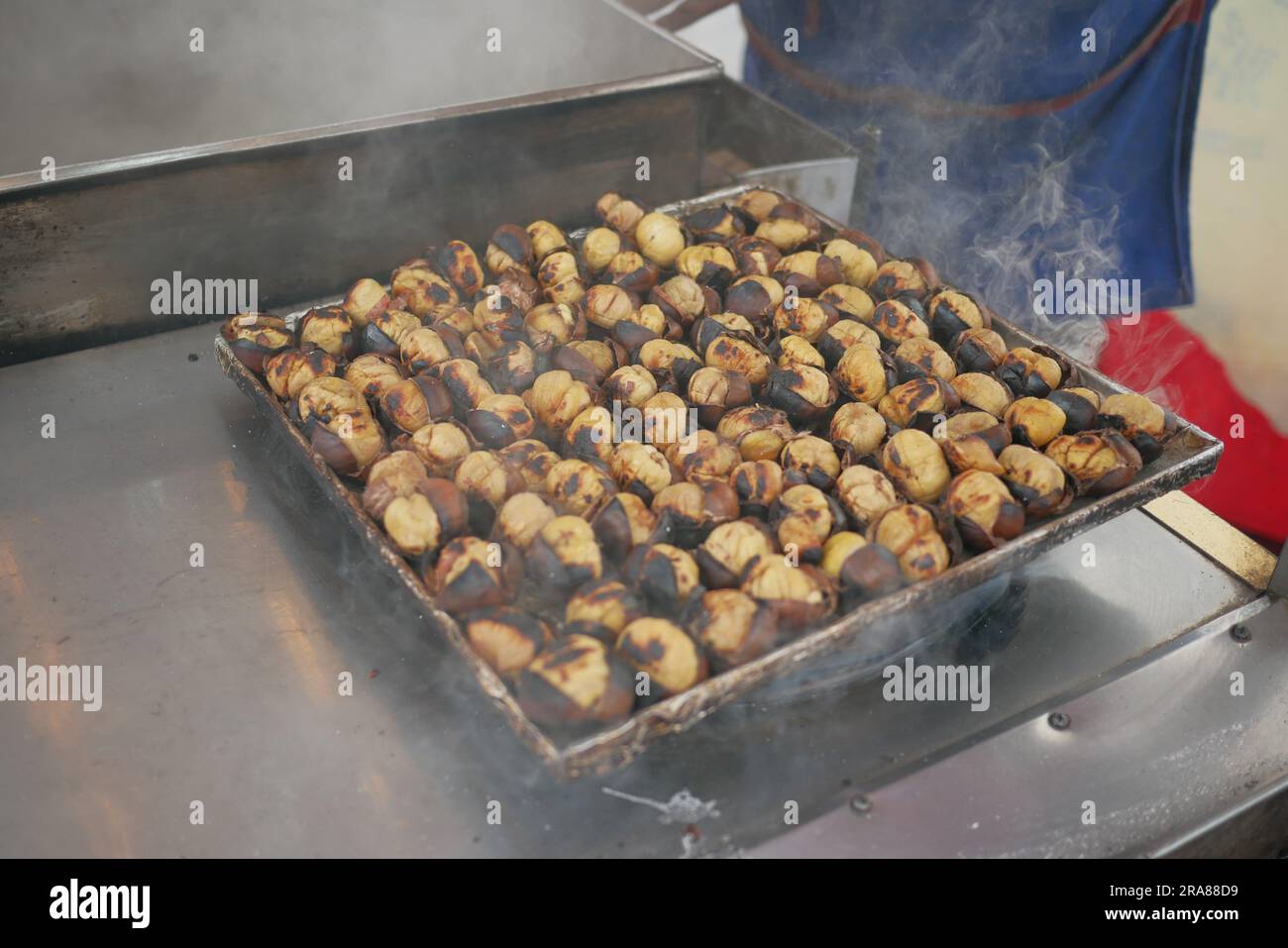 traditional Istanbul street food grilled chestnuts in a row Stock Photo ...