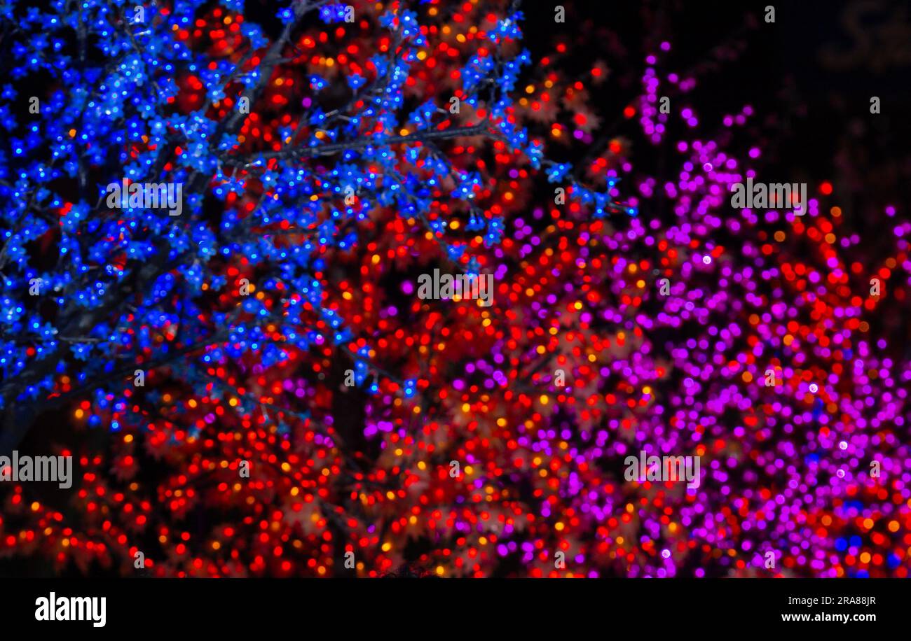 Bokeh, the light from the LED lamp looks blurry, blue, red, pink Stock Photo - Alamy