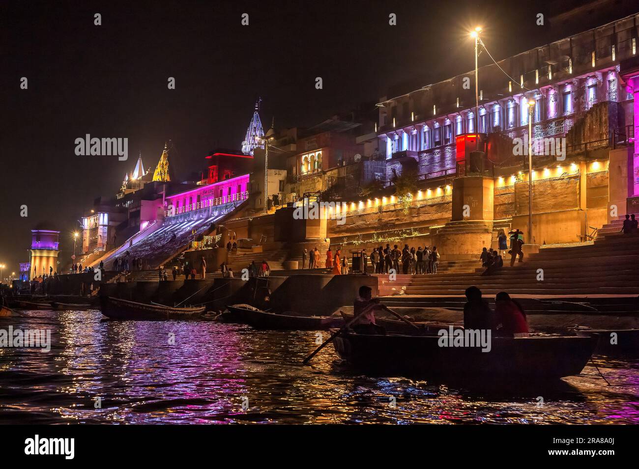 Night view of the palaces on the banks of the Ganges River in Varanasi ...