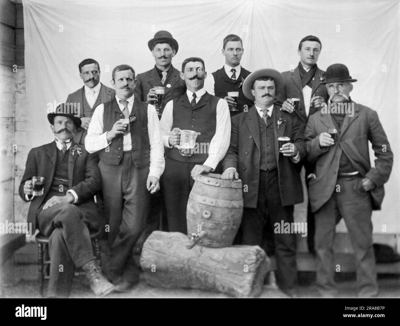San Francisco, California: 1895. A group of men with full glasses ...