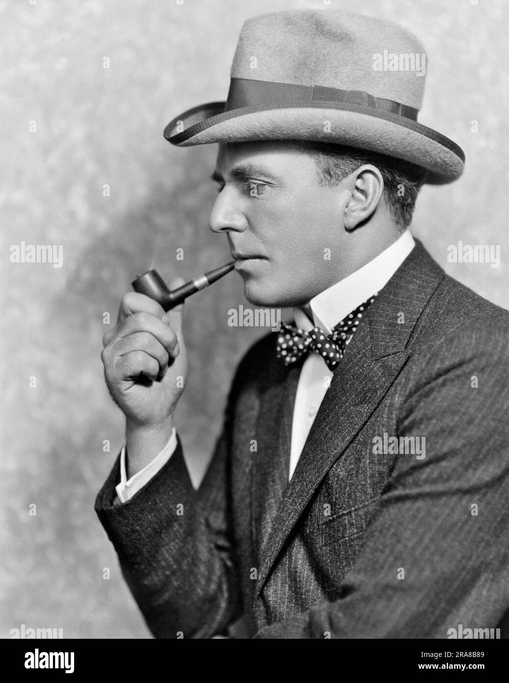 Hollywood, California: 1923 Actor House Peters contemplates his pipe in ...