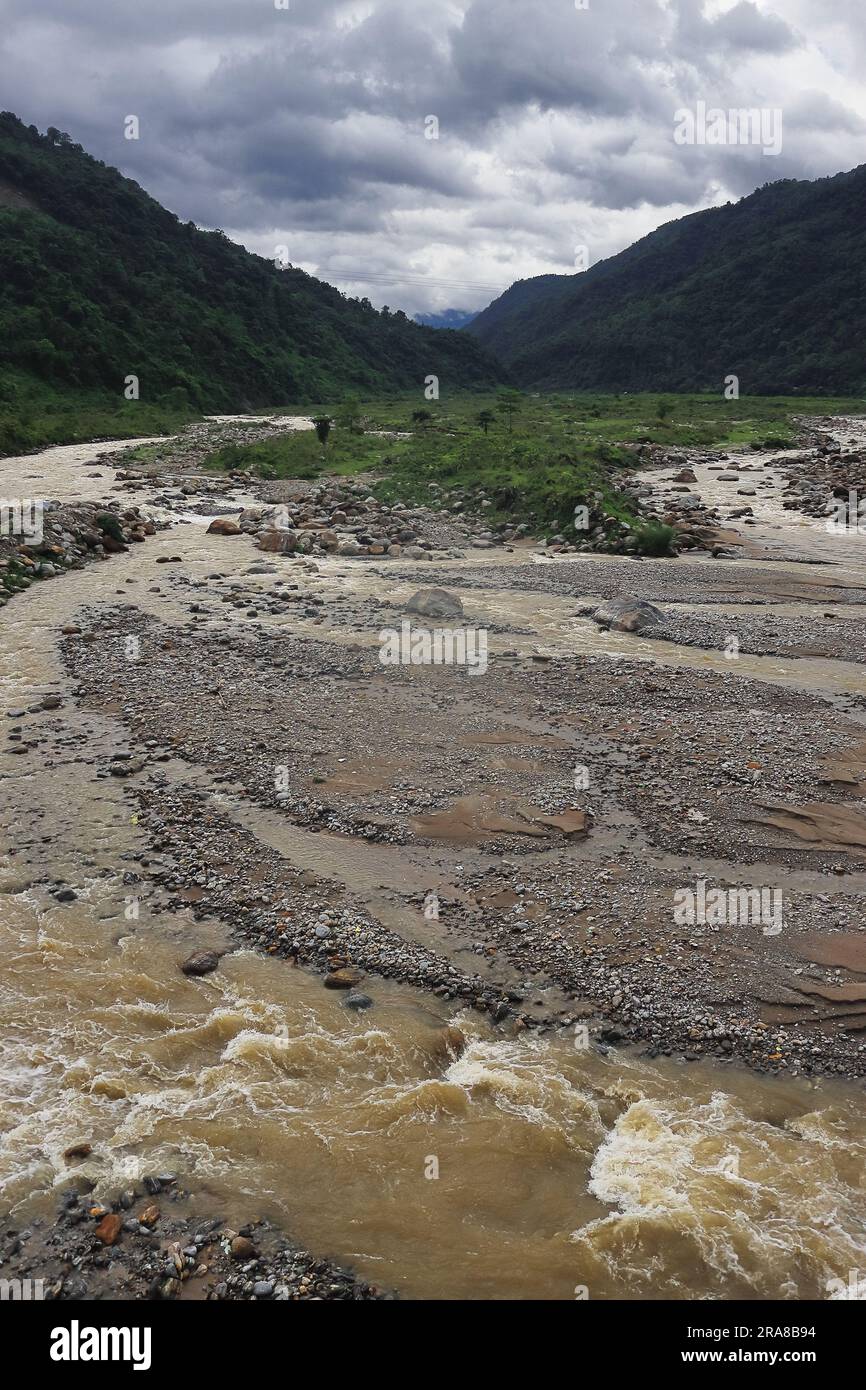 beautiful river valley, flowing stream, forest and himalaya foothills ...