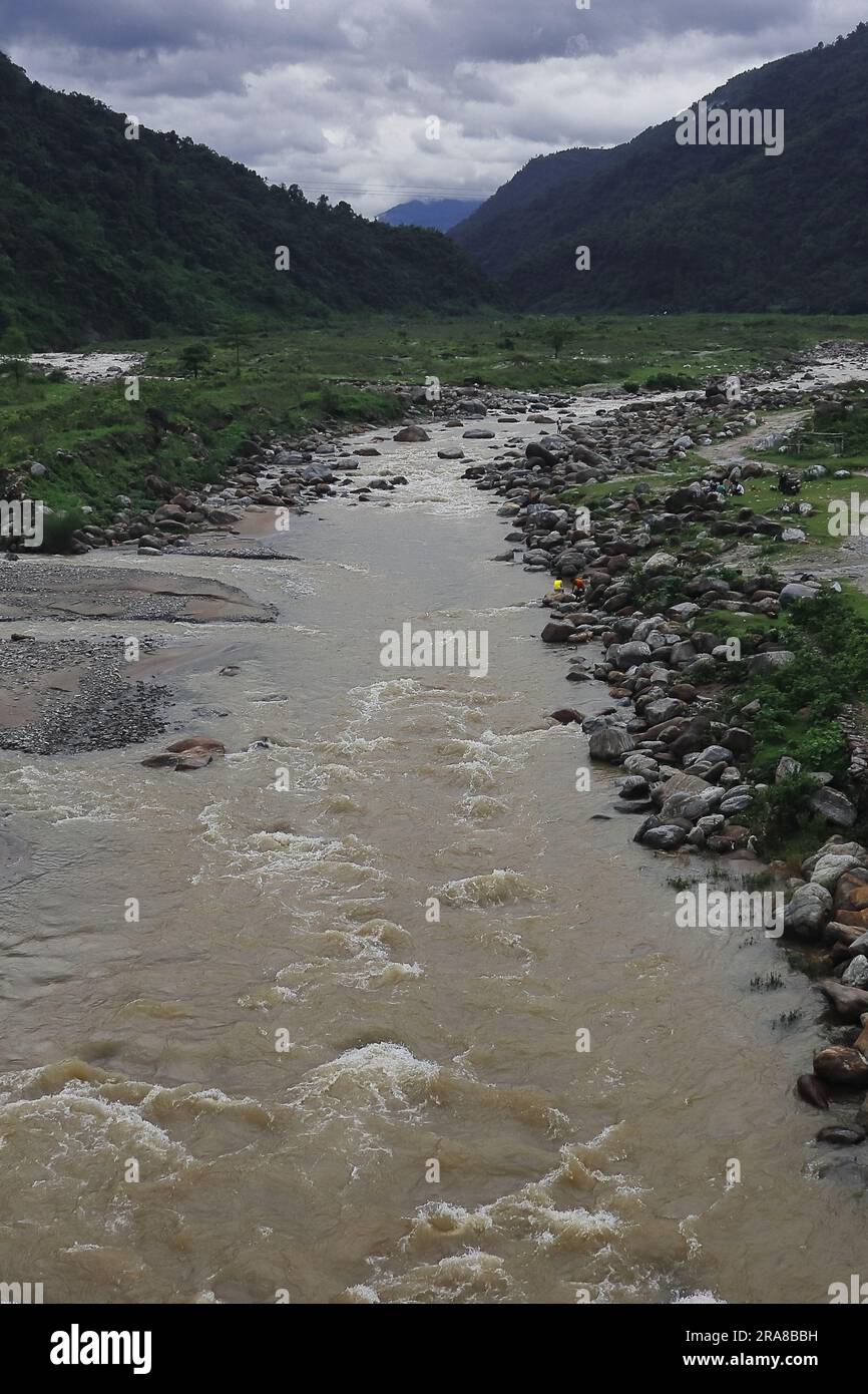 beautiful river valley, flowing stream, forest and himalaya foothills ...