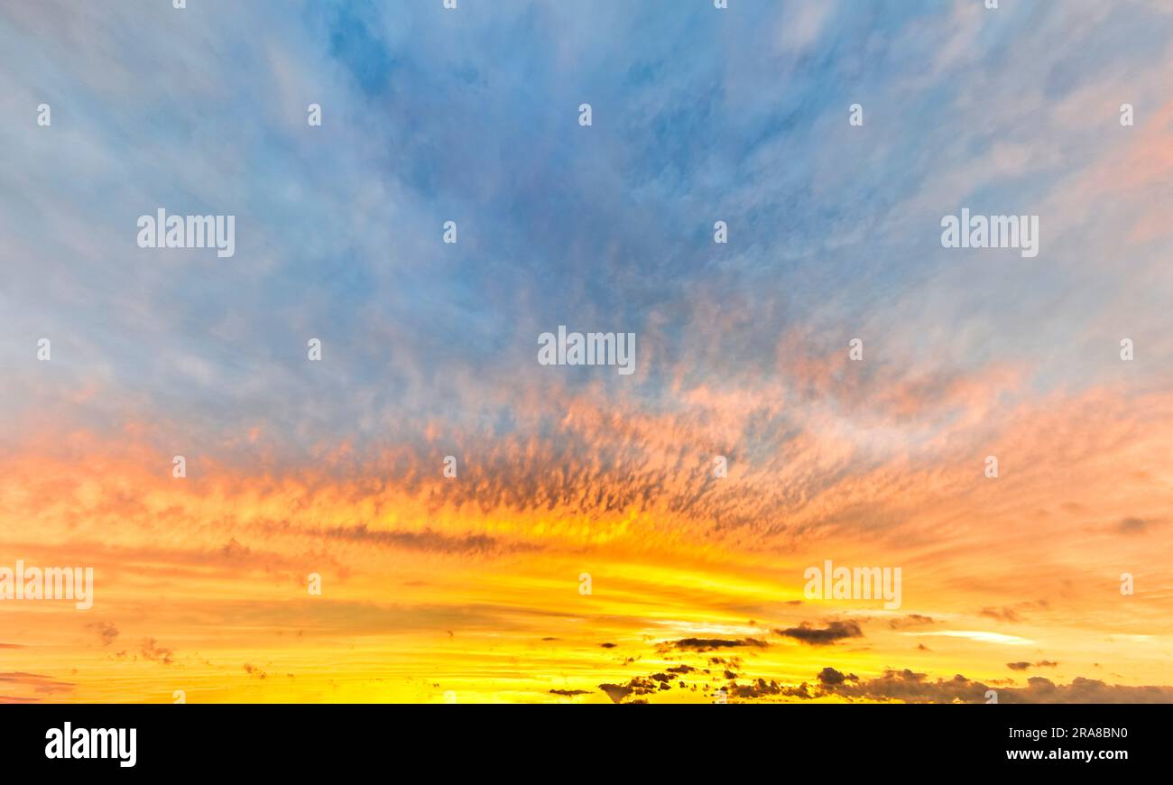 Wild, fiery evening sky with clouds just before sunset Stock Photo - Alamy