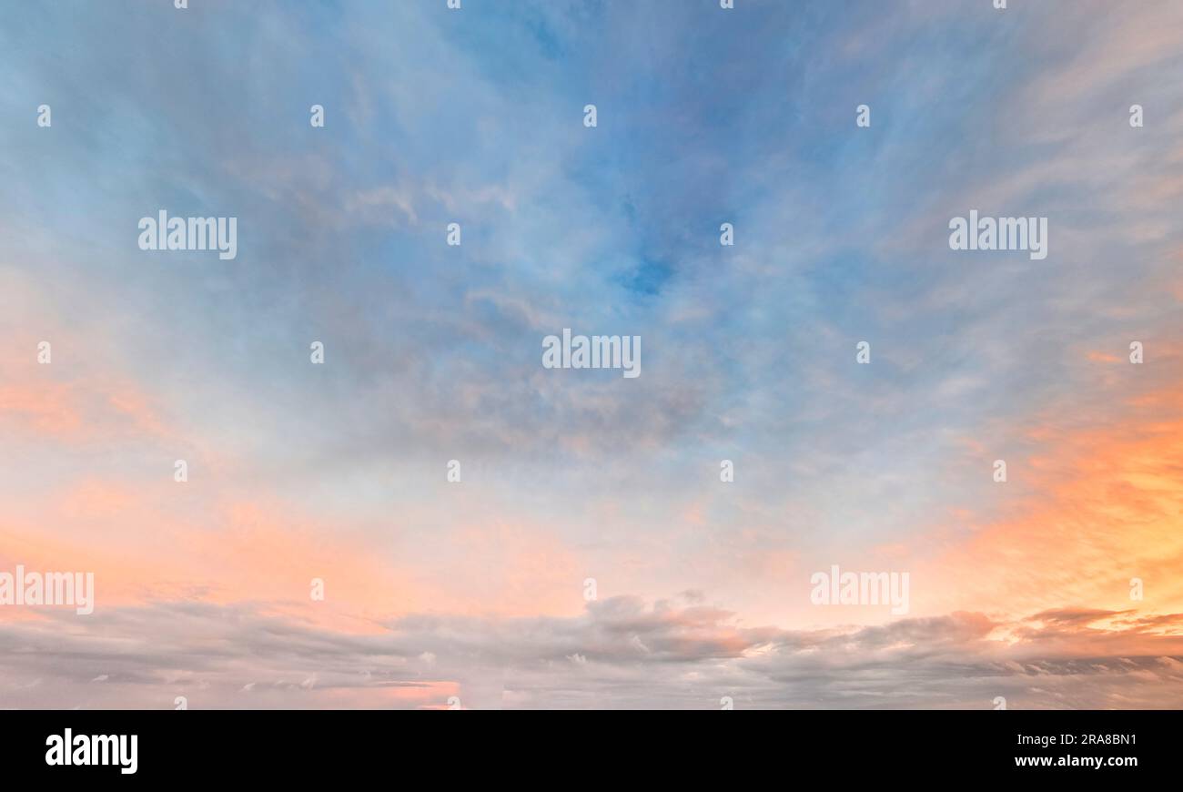Wild, fiery evening sky with clouds just before sunset Stock Photo - Alamy
