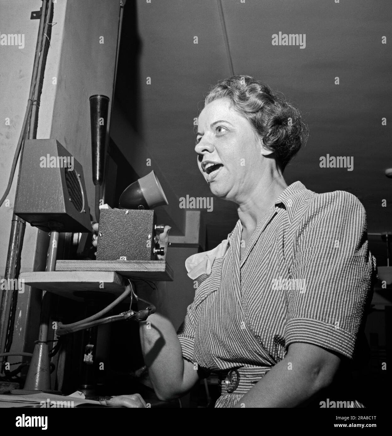 Washington, D.C., June, 1943 Miss Mabel Stargel talks into a microphone ...