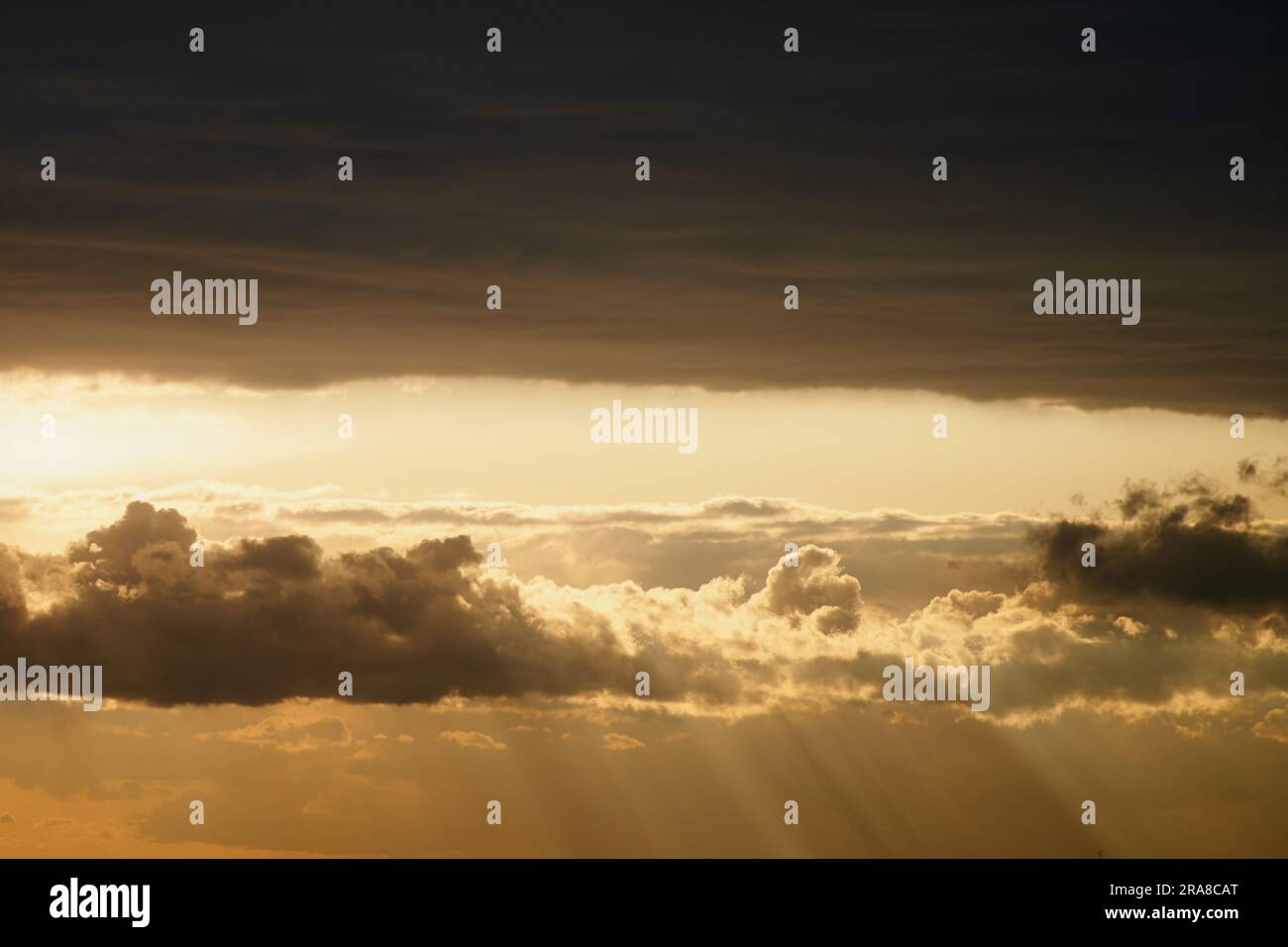 The setting sun cast long shadows across the landscape, signaling the ...