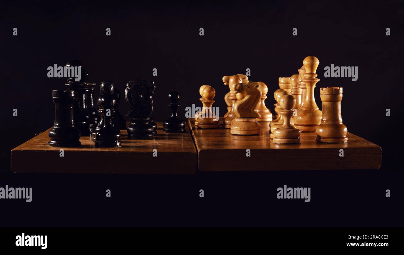 Playing with retro chess pieces in the middle game. Chess board with ...