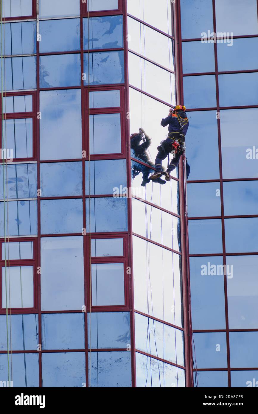 The window cleaner on the highrise office building was working ...