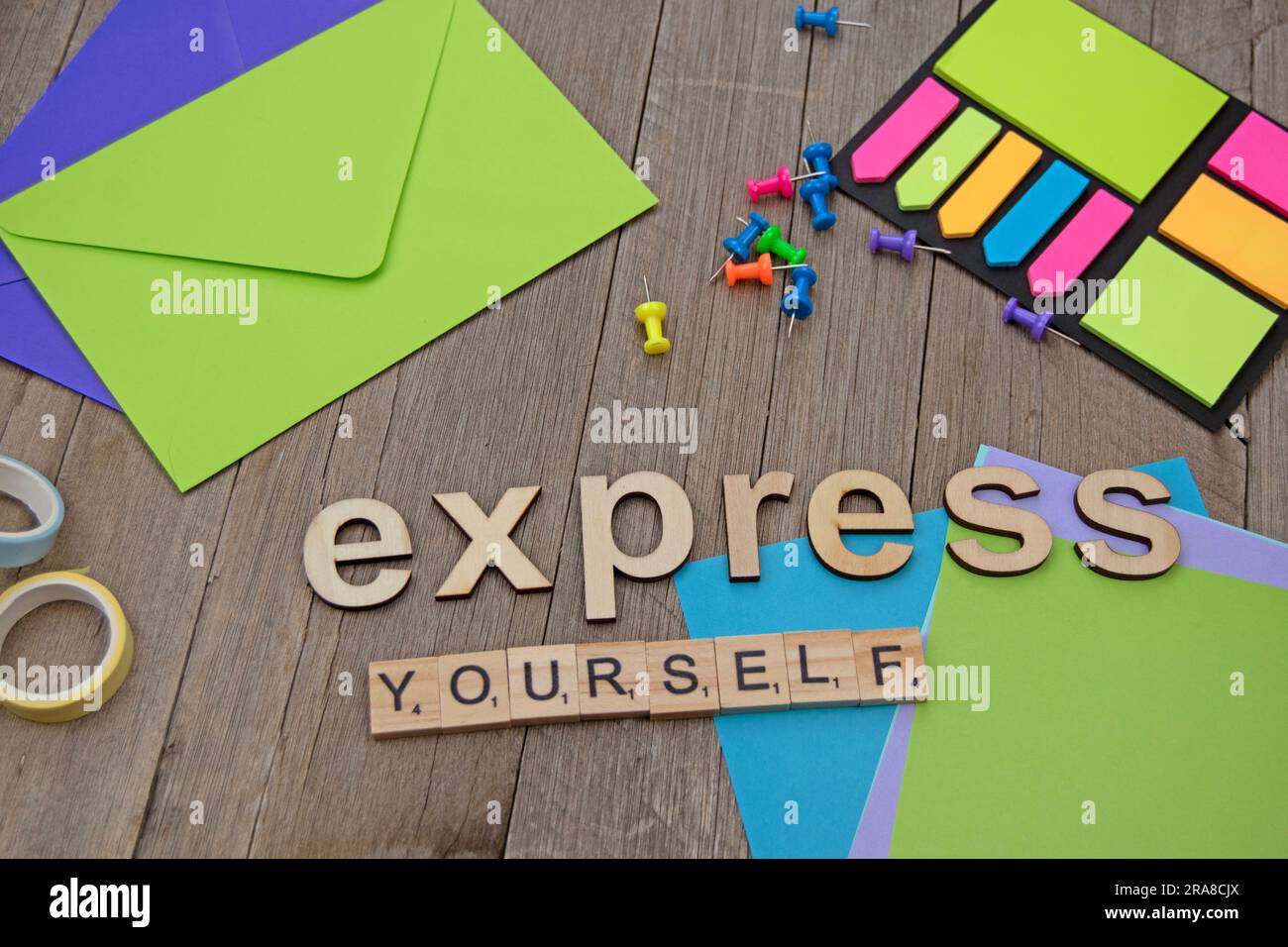 Express yourself letters on wooden board with coloured paper. Coloured ...