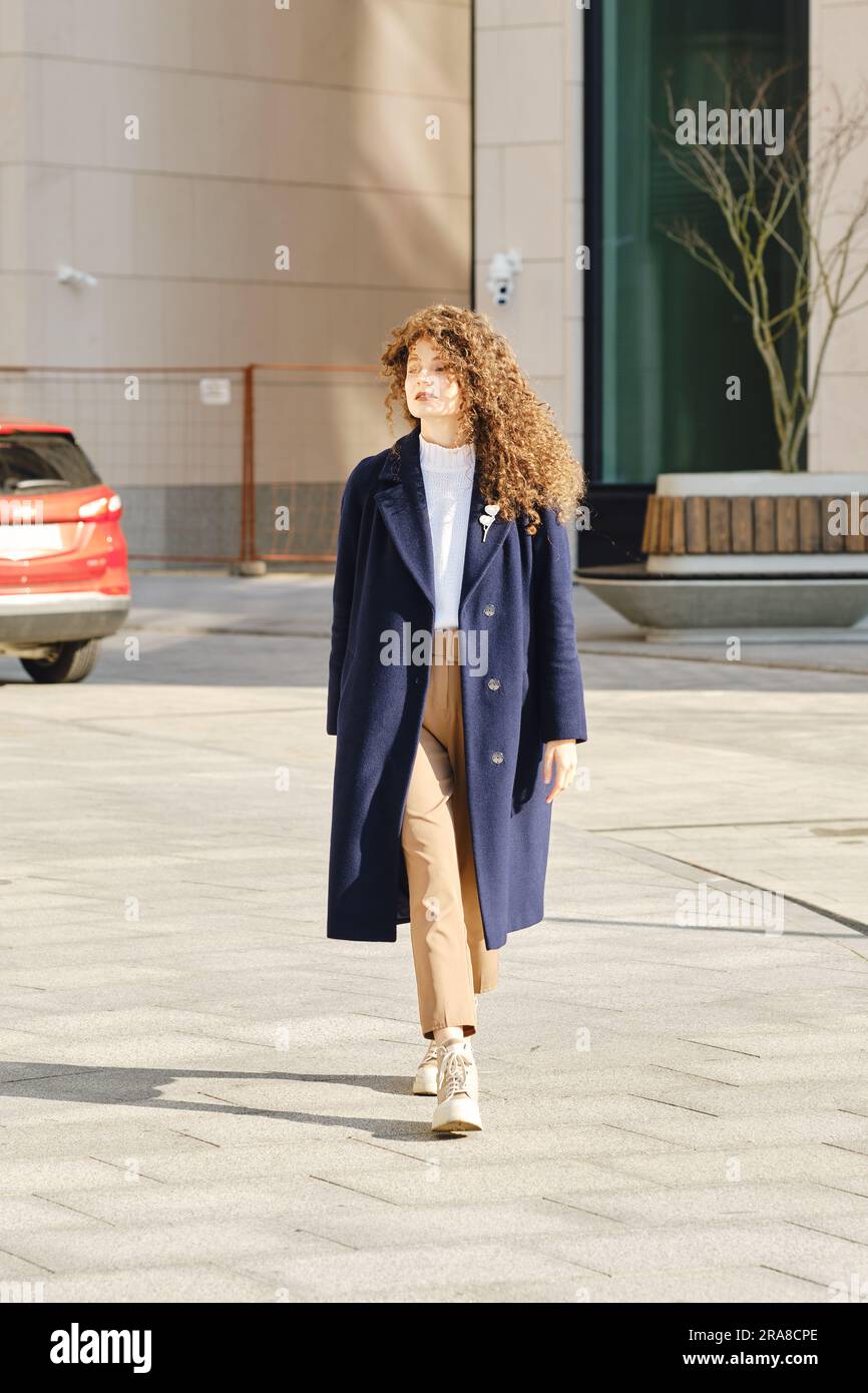 Female look around on street hi-res stock photography and images - Alamy