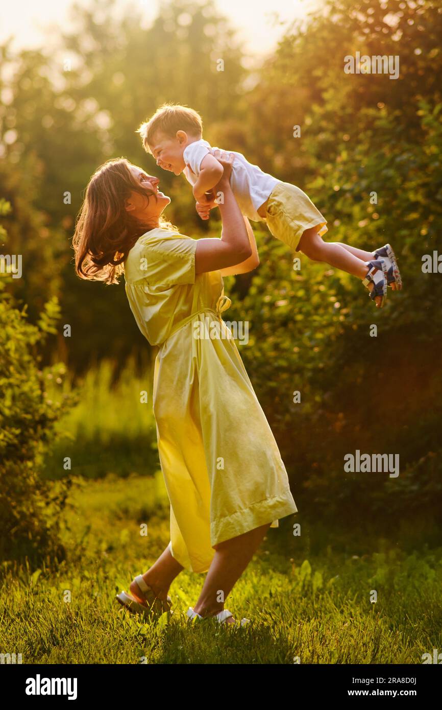 Mother tossing child hi-res stock photography and images - Alamy