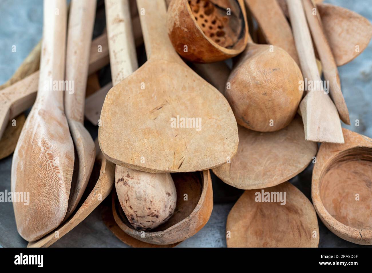 Different sizes of wooden spoon closeup Stock Photo - Alamy