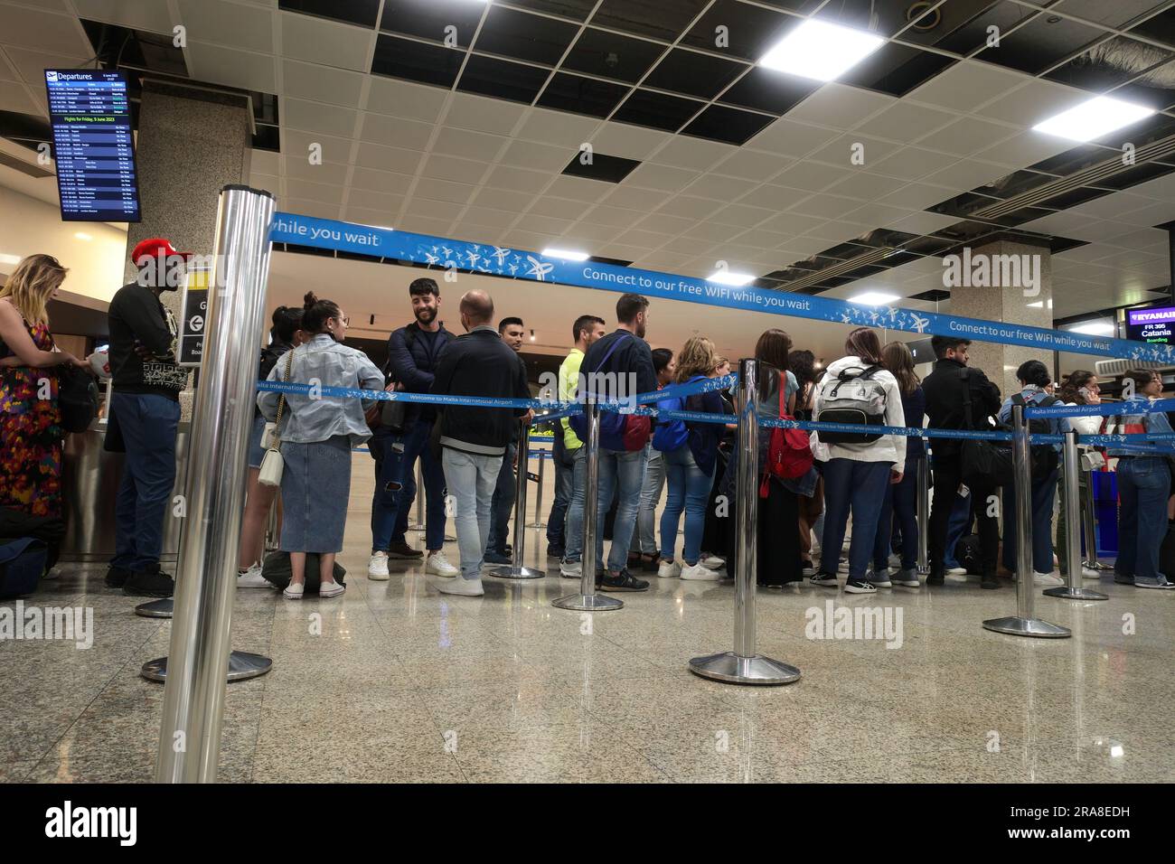 people queuing to departure gate for boarding from Malta airport Stock ...