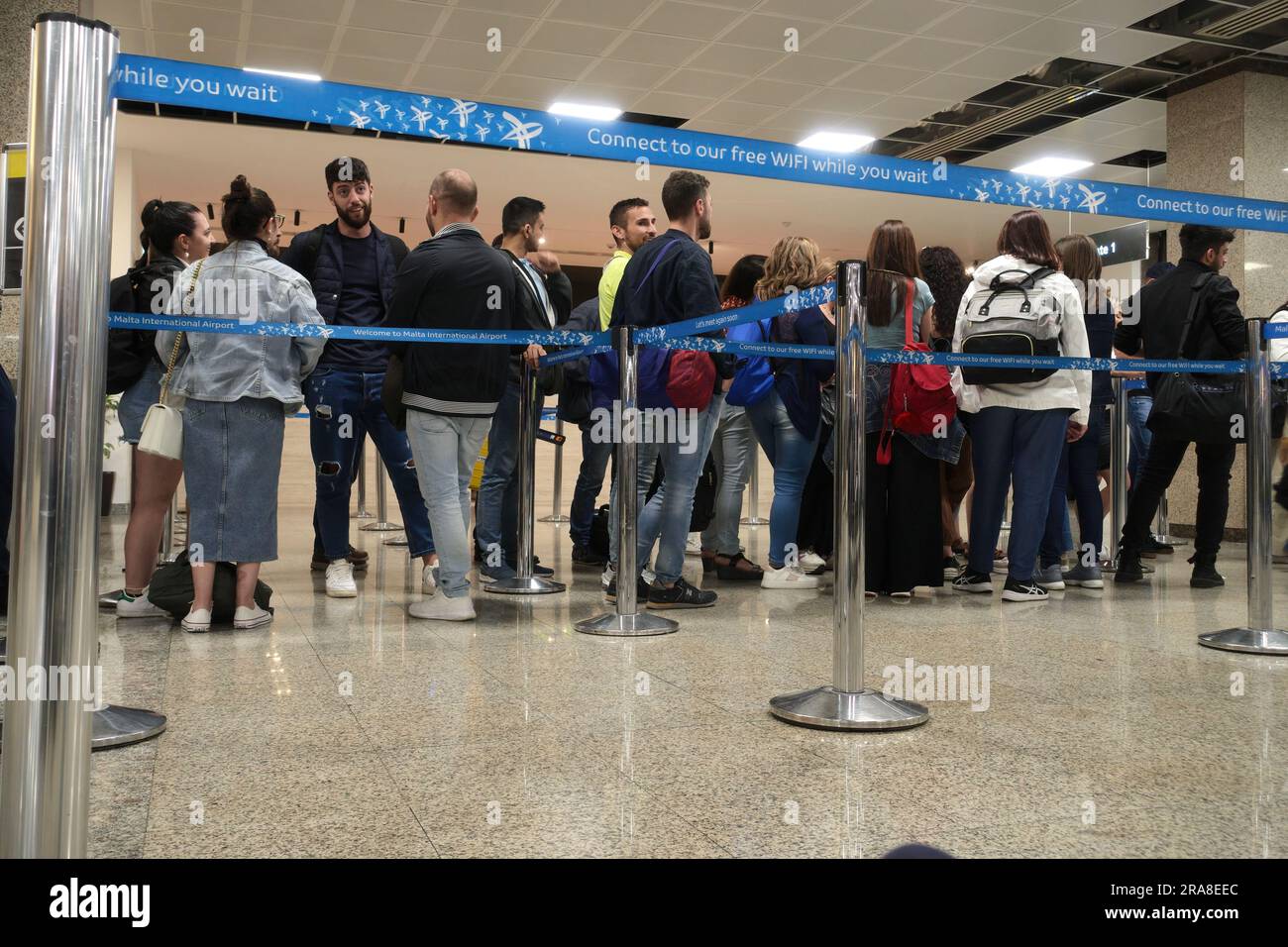 people queuing to departure gate for boarding from Malta airport Stock ...