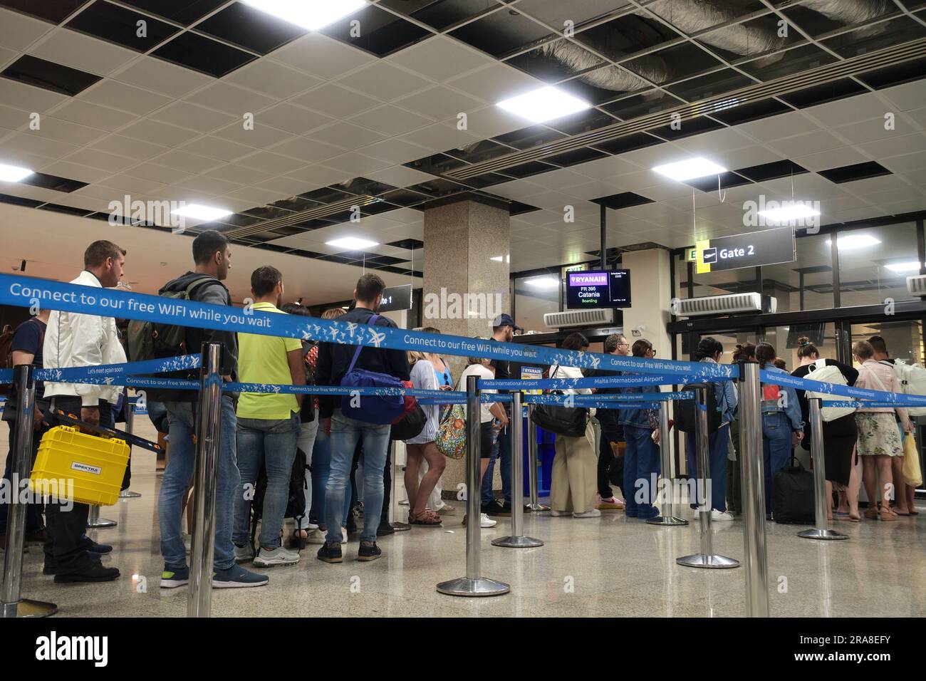 people queuing to departure gate for boarding from Malta airport Stock ...