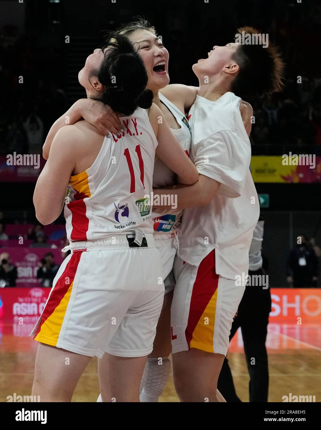 China's Li Meng, centre embraces teammates Luo Xinyu, left, and Yuan Li ...