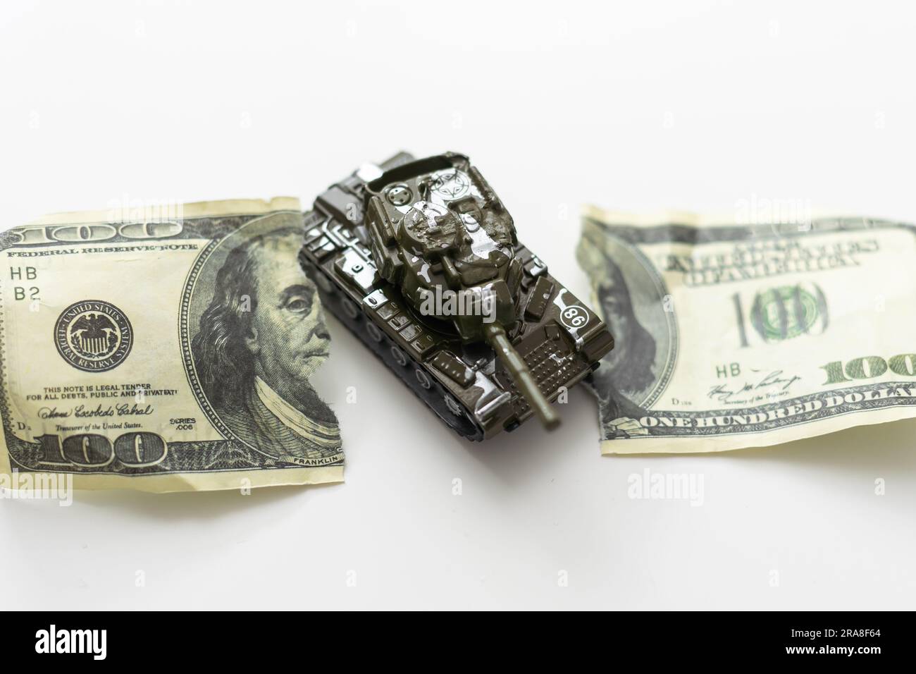 One Hundred Dollar Bill Ripped in Half Isolated on a White Background ...