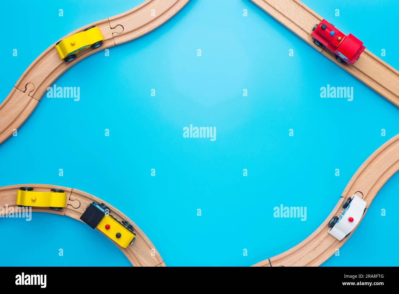 Baby kid toys background. Toy train and wooden rails on blue background ...