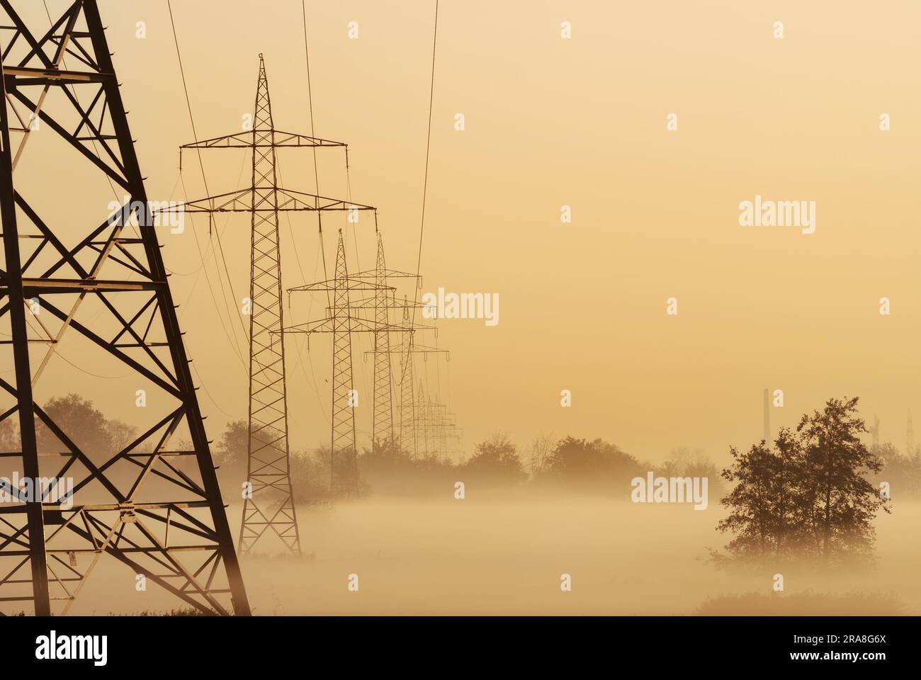 Pylons in misty landscape hi-res stock photography and images - Alamy